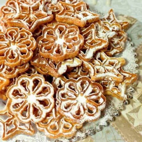Fried Rosette Snowflake Cookies Recipe with Confectioners Sugar Dusting